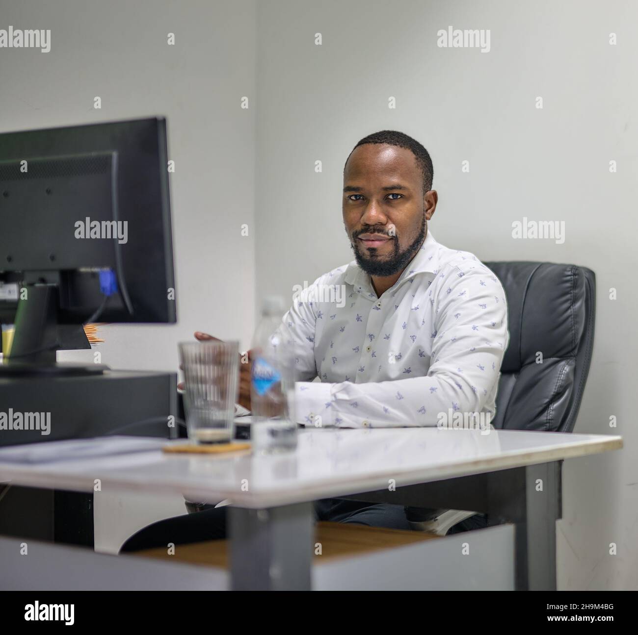 Young African American CEO working in his office Stock Photo - Alamy