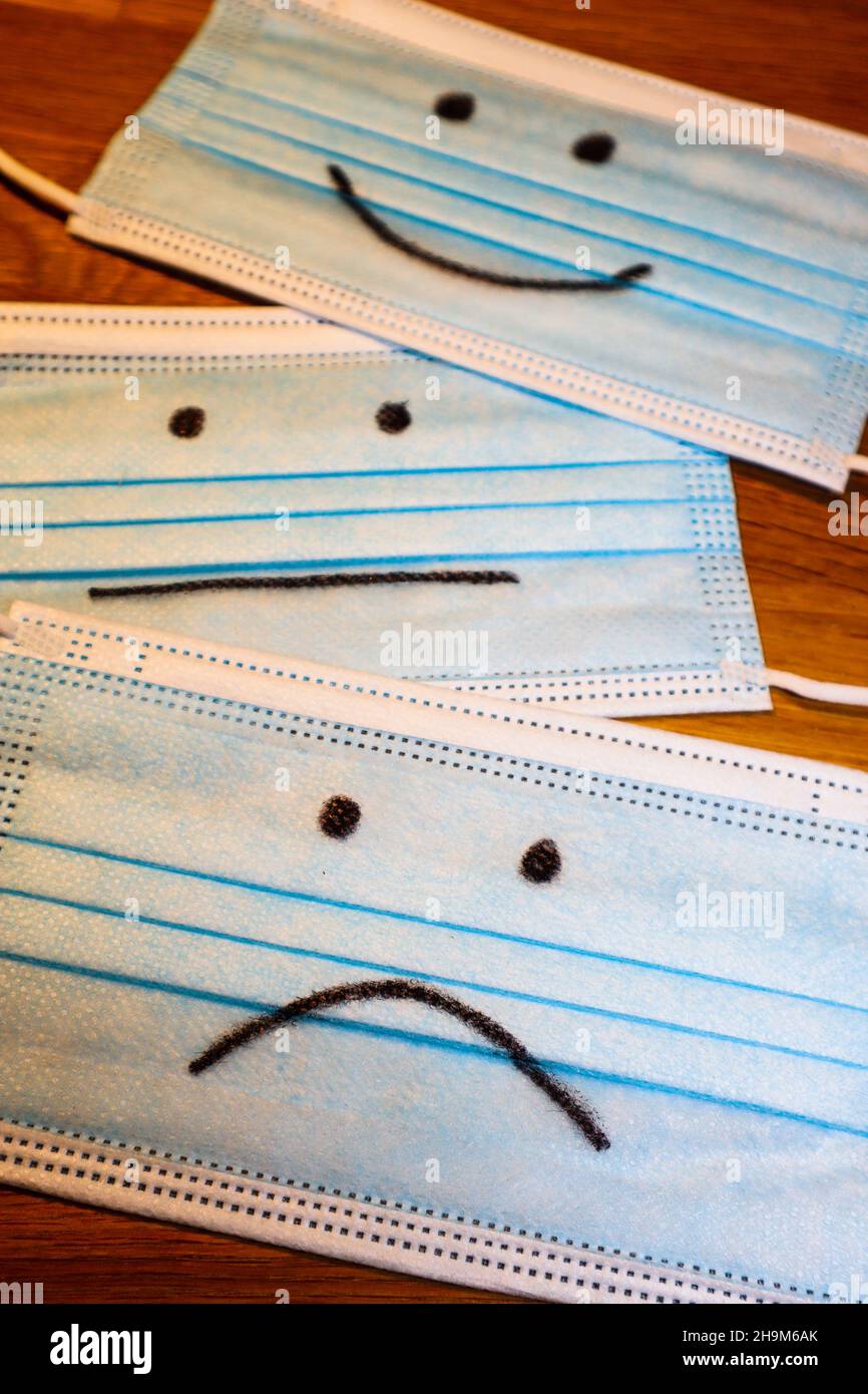 corona medical face masks with smiling faces happy and unhappy Stock ...