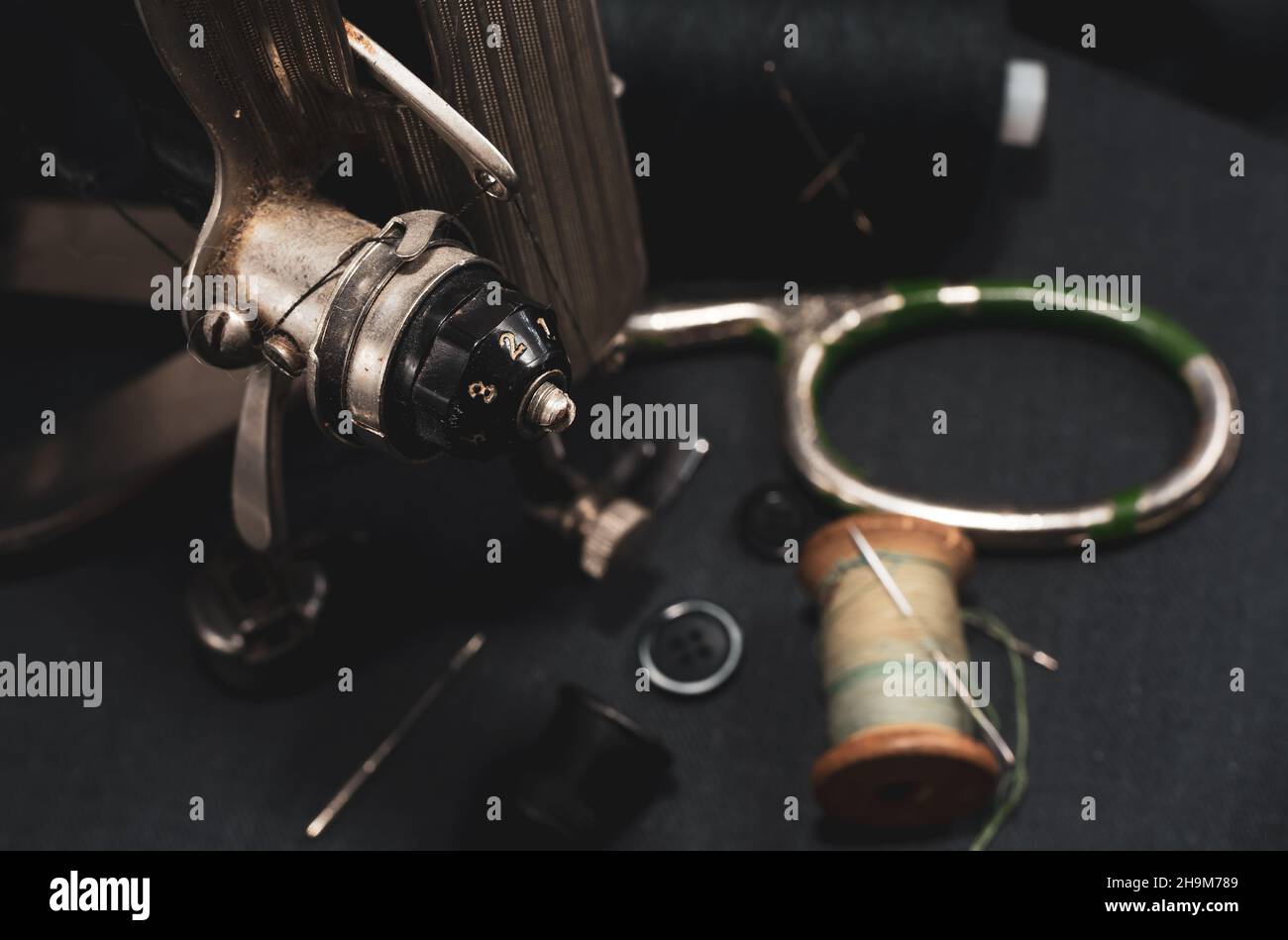 Retro tools for cutting and sewing. Needle with thread, thimble, sewing ...