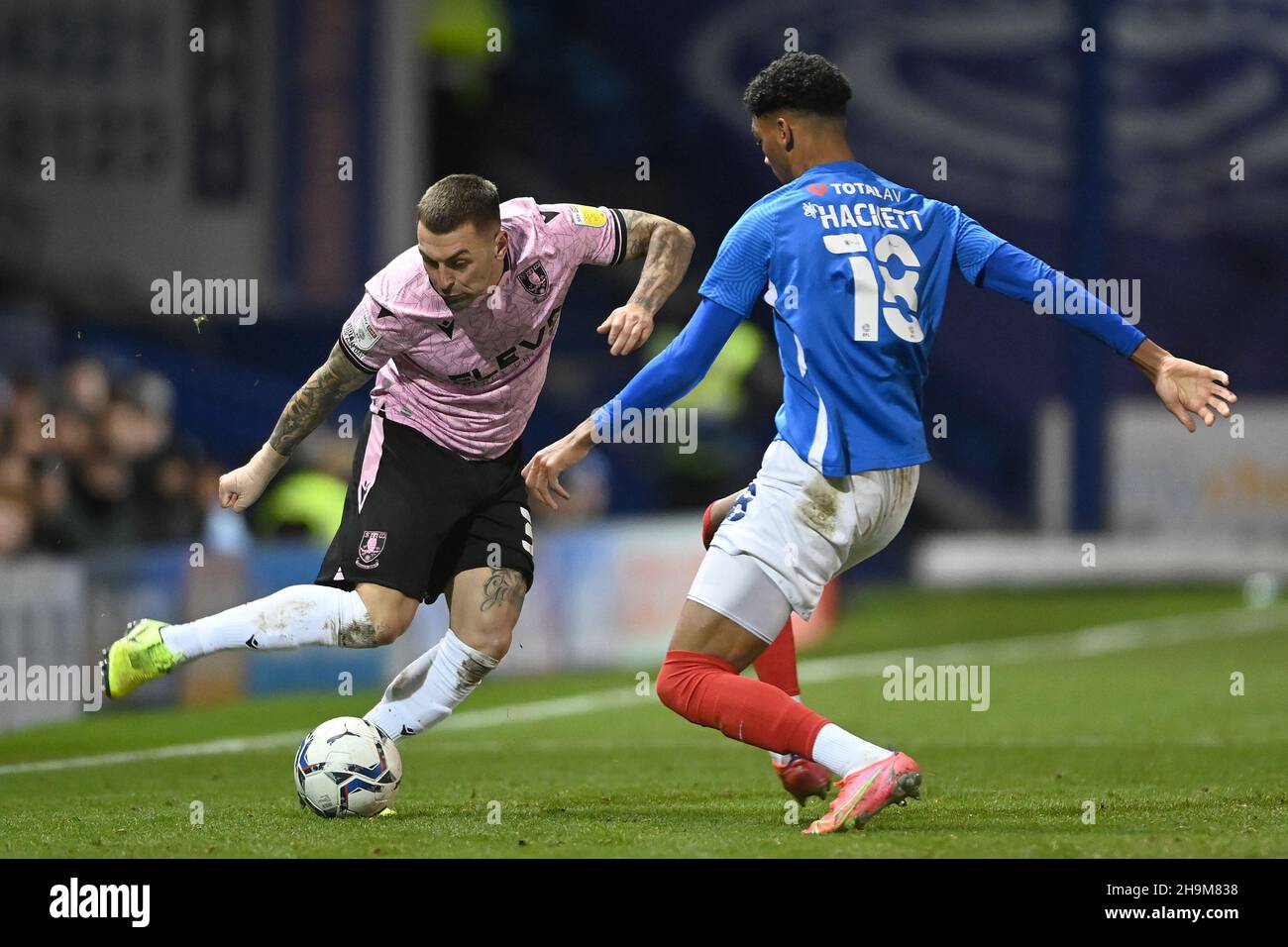 Jack Hunt #32 of Sheffield Wednesday under pressure from Reeco Hackett ...