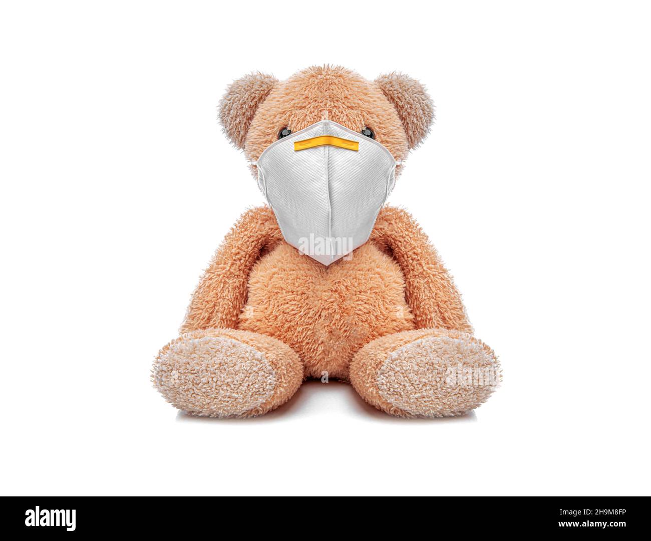 Teddy bear with face mask on his mouth on a white background Stock ...