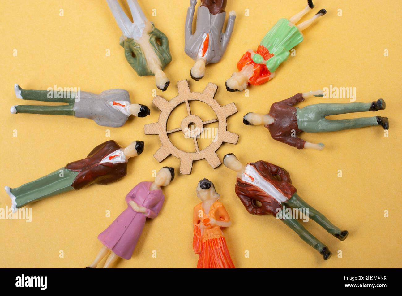 Colorful diverse miniature people figurines make crowd on ground Stock ...