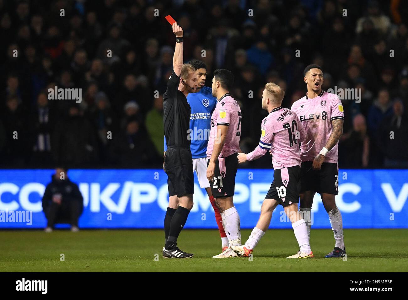 Massimo Luongo #21 of Sheffield Wednesday is shown a red card Stock ...