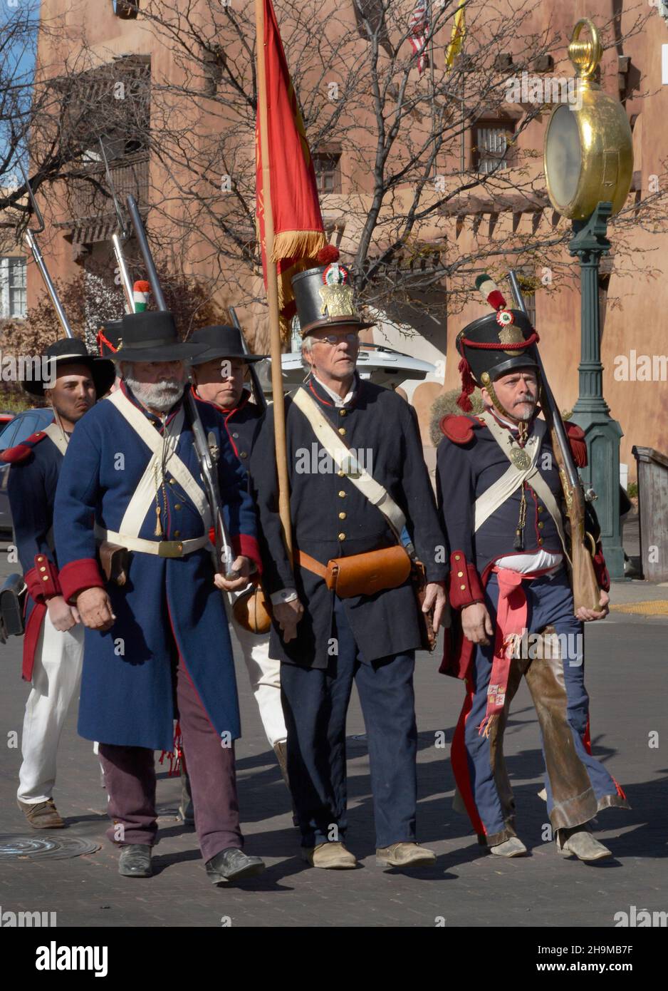 Reenactors in period Mexican infantry uniforms present a dramatic ...