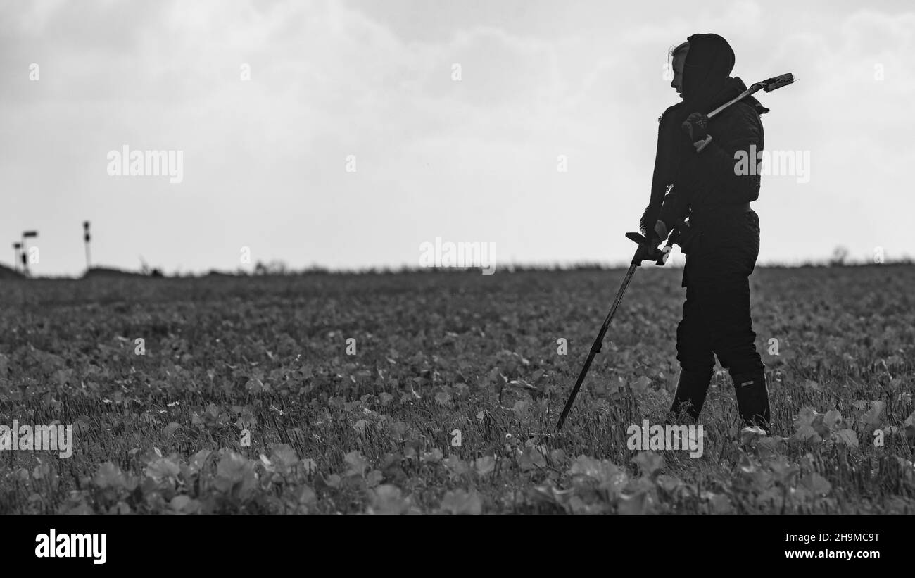 Young woman searcing in the wind Stock Photo - Alamy