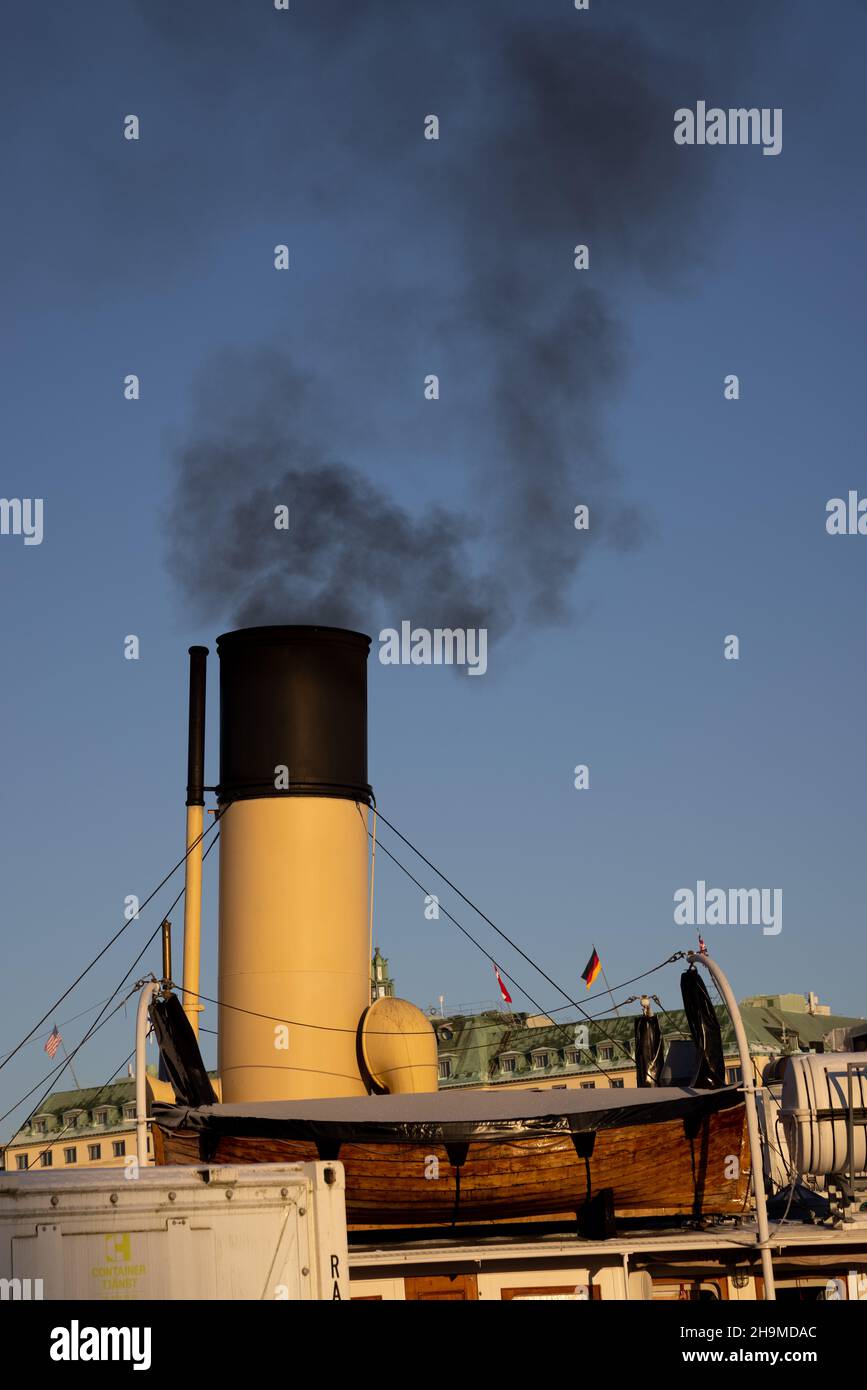 Air pollution in Stockholm. Chimney of boat with black smoke coming out ...