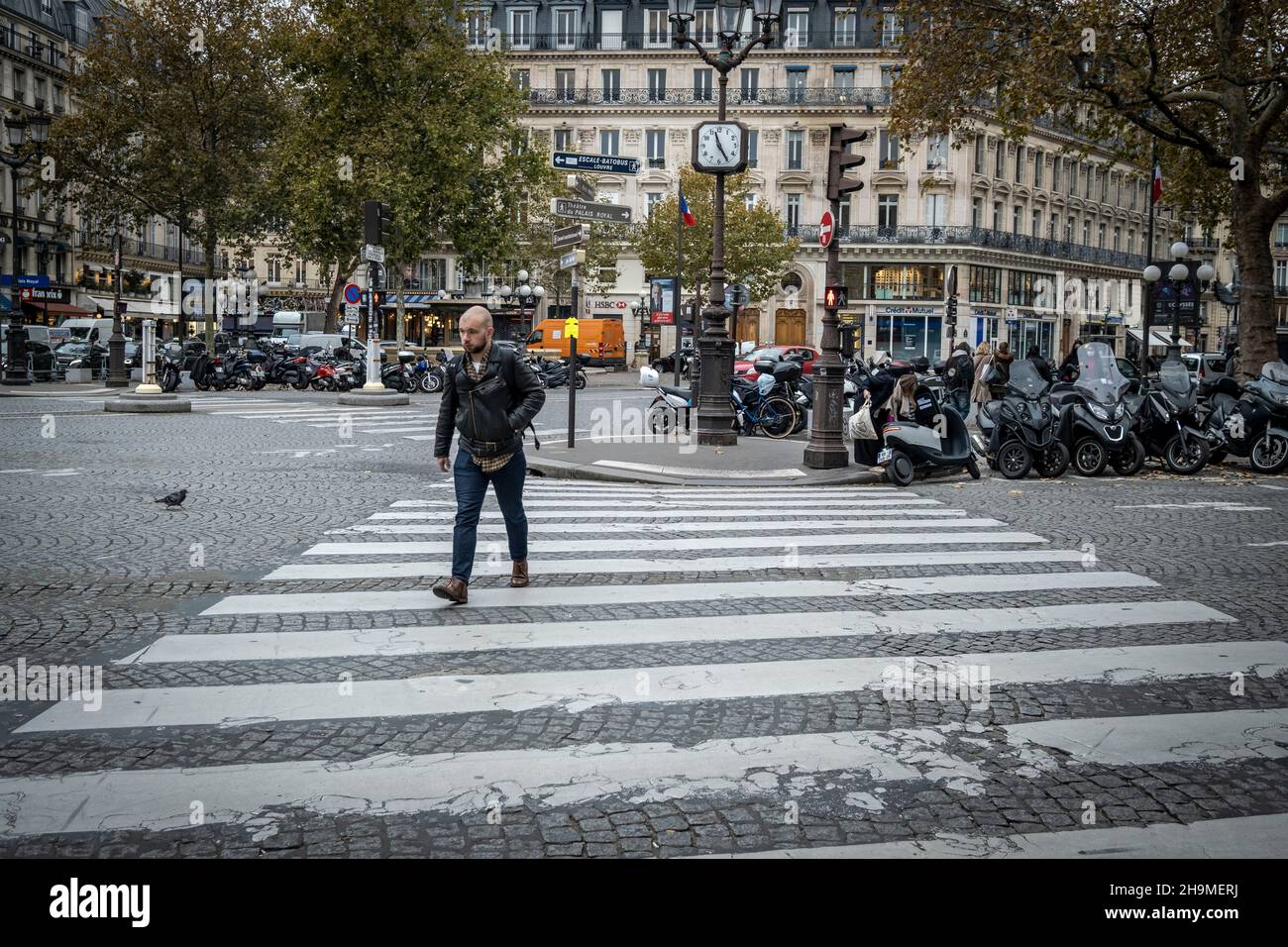 Street scene at the streets fo Paris and people walking around. Paris ...