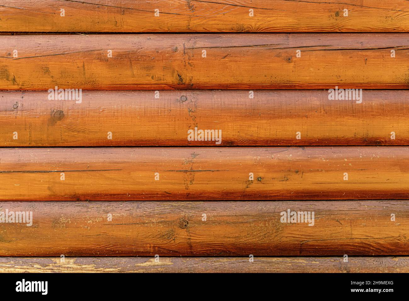 Log background. Rough wood texture. The walls of a country house are ...
