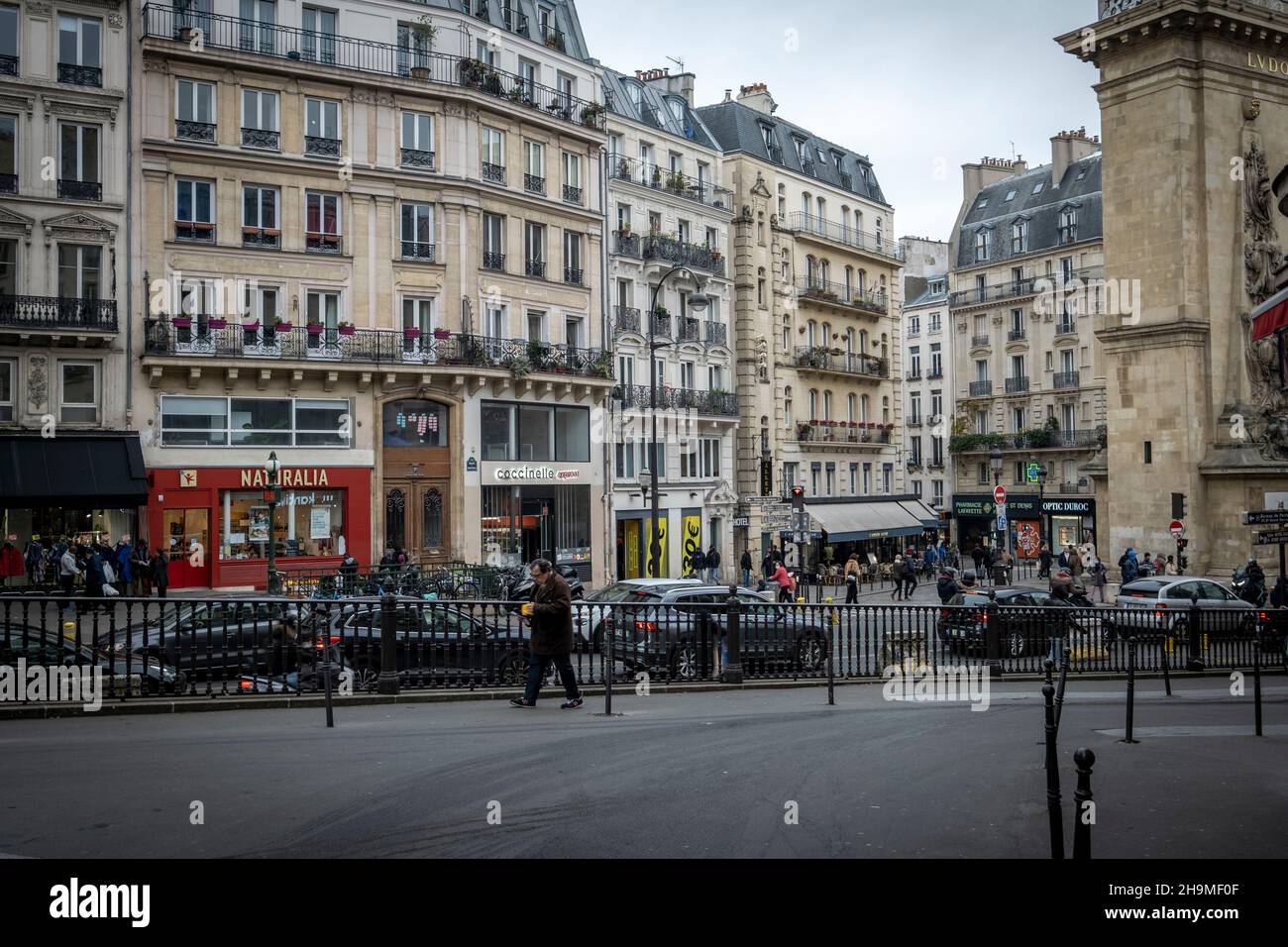 Street scene at the streets fo Paris and people walking around. Paris ...