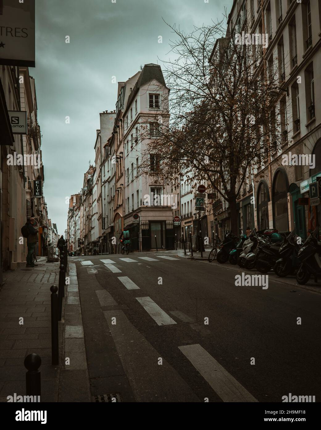 Street scene at the streets fo Paris and people walking around. Paris ...