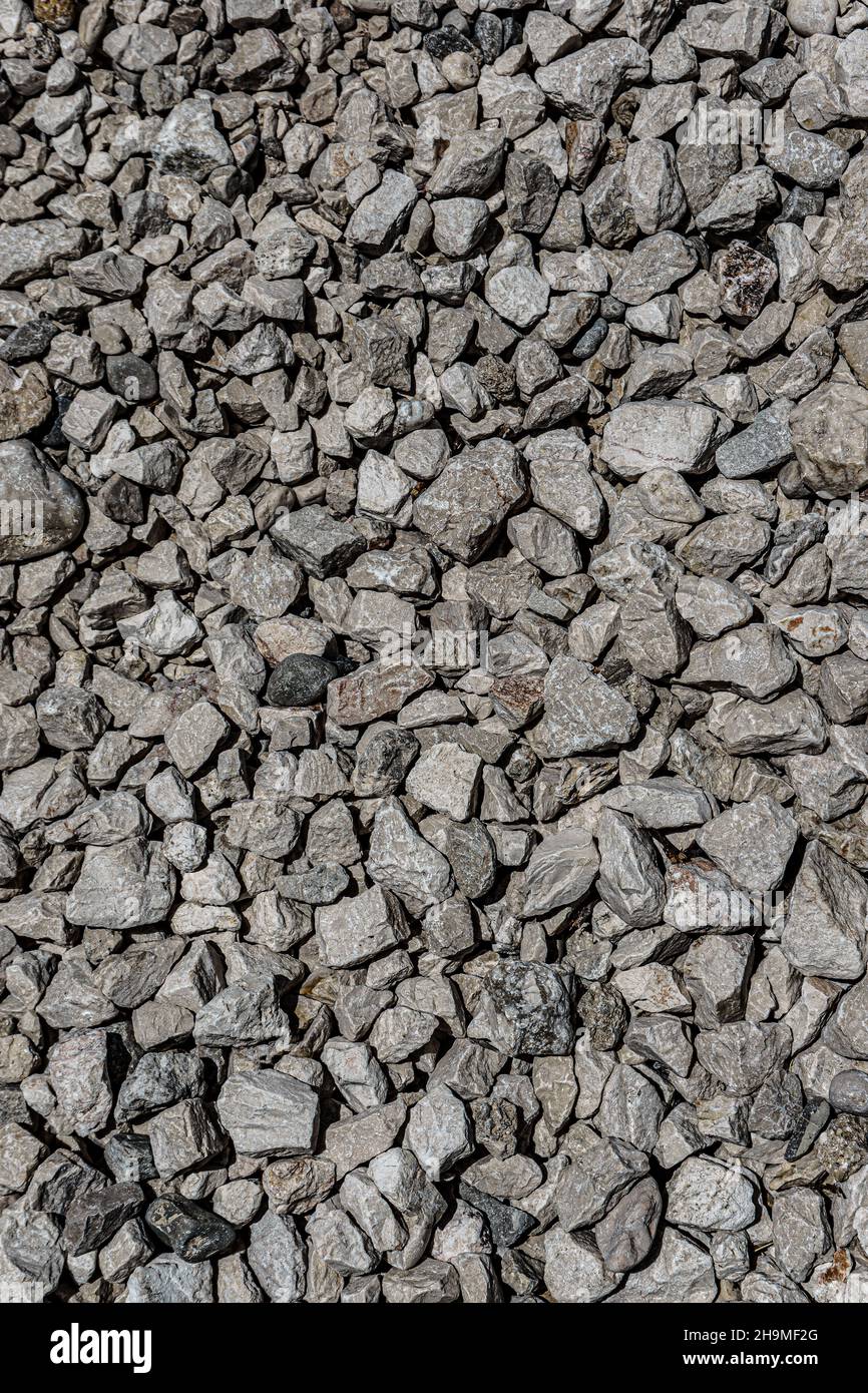 The texture of fine gravel. Granite gray background. Lots of small ...