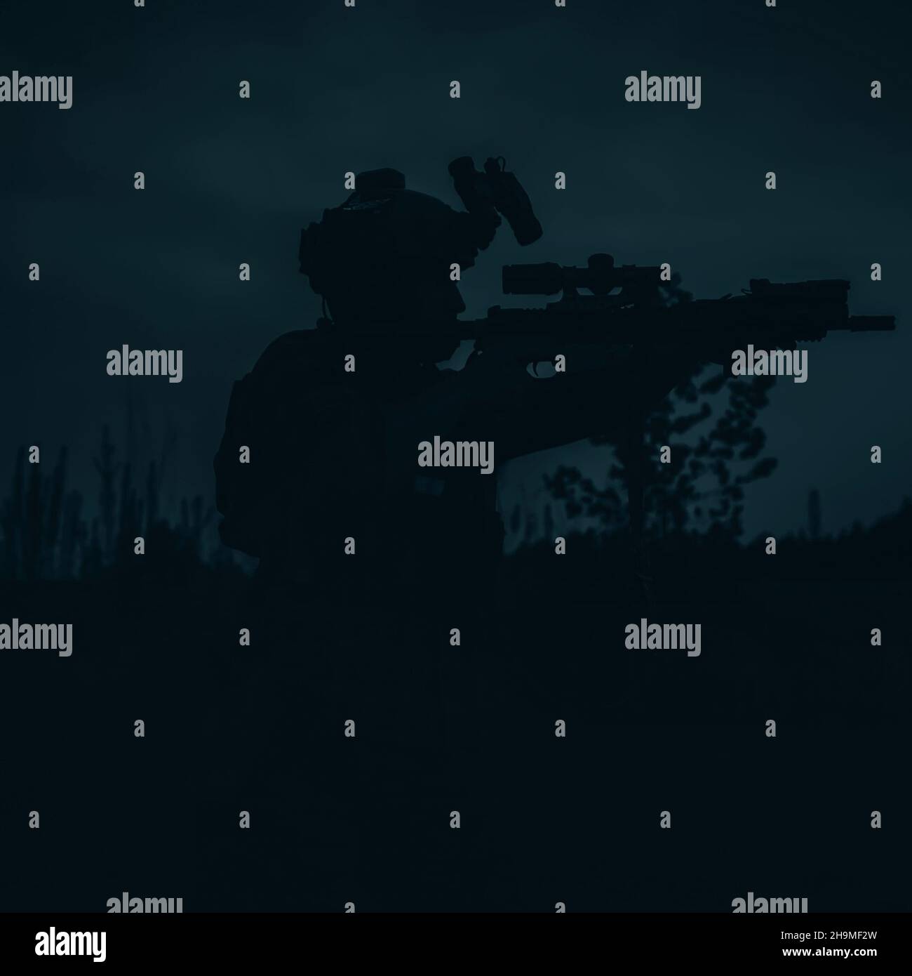 Vertical shot of a soldier of special forces at night Stock Photo - Alamy