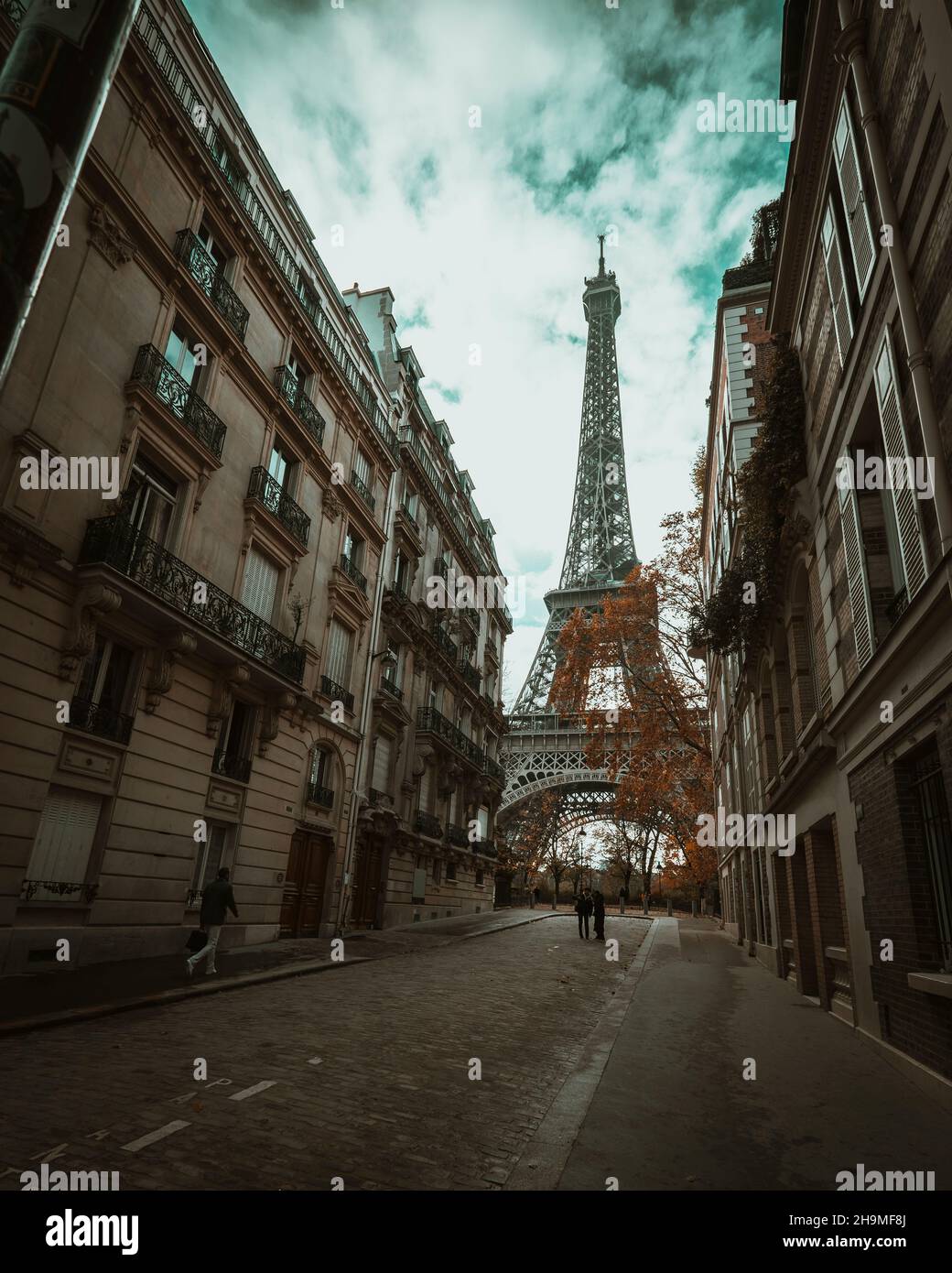 A back alley in Paris showcasing the architecture of the buildings with ...