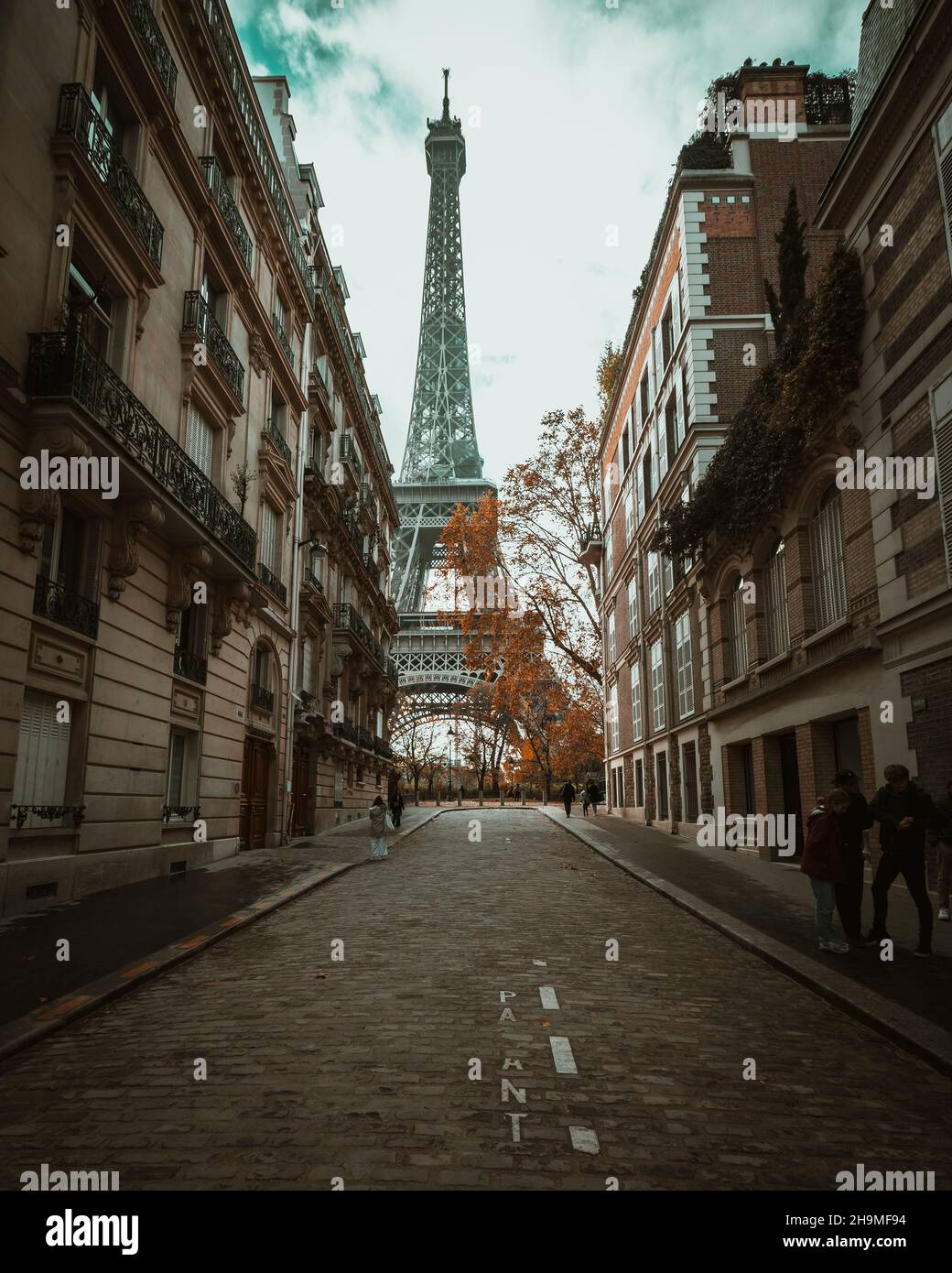 A back alley in Paris showcasing the architecture of the buildings with ...