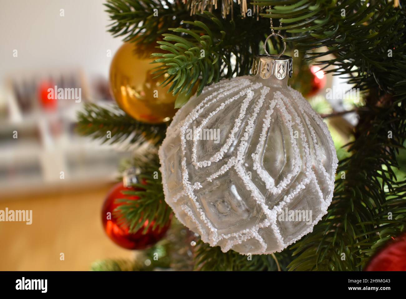 Frozen ball in the Xmas tree Stock Photo - Alamy