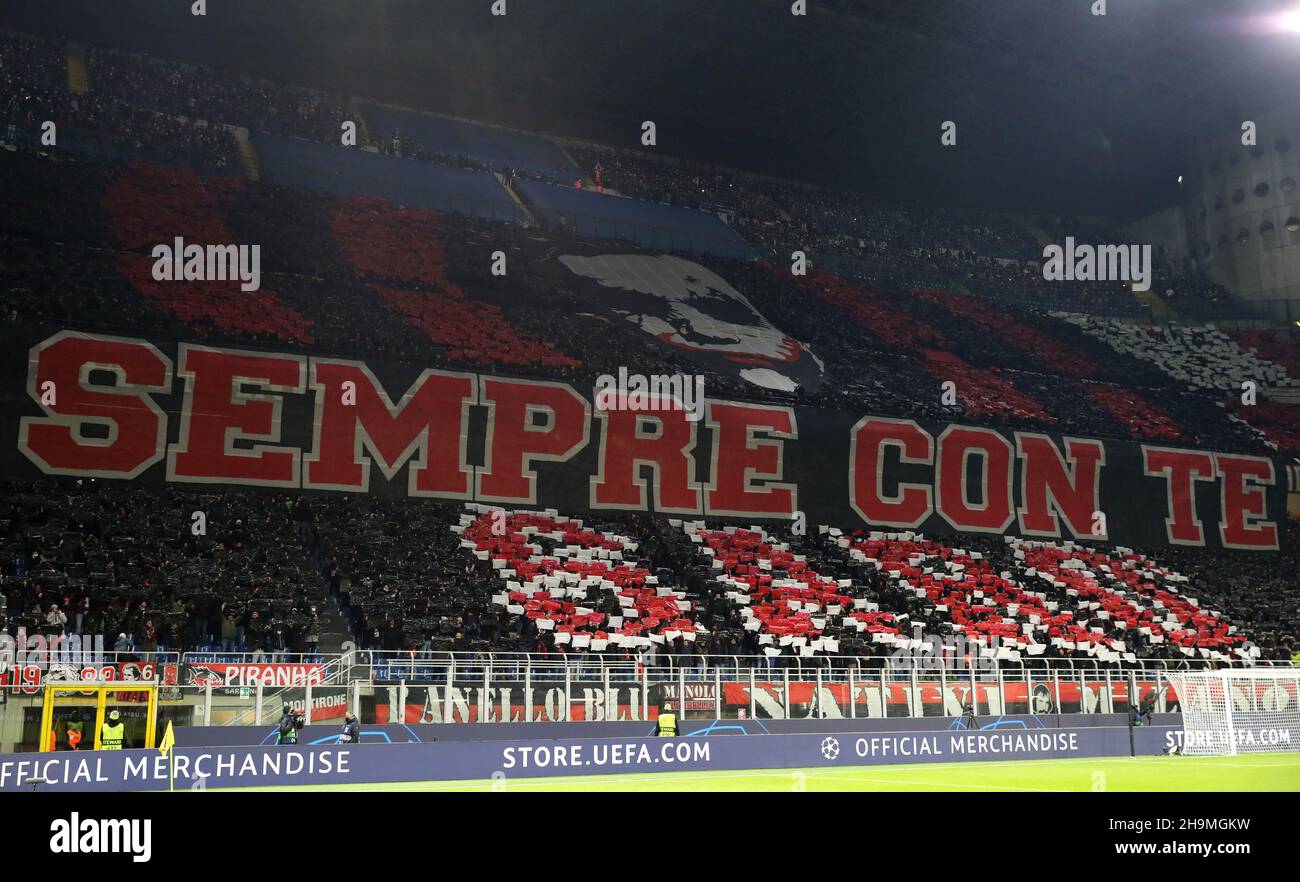 AC Milan fans complete a banner in the stands to read 'SEMPRE CON TE ...