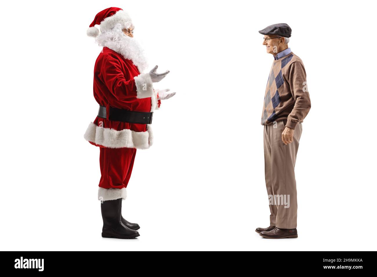 Santa Claus standing and talking to an elderly man isolated on white ...