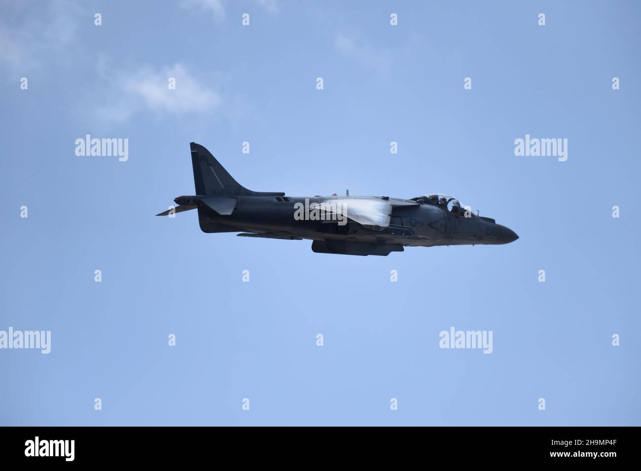 United States Marine Corps AV-8B Harrier makes transonic vapor during a ...