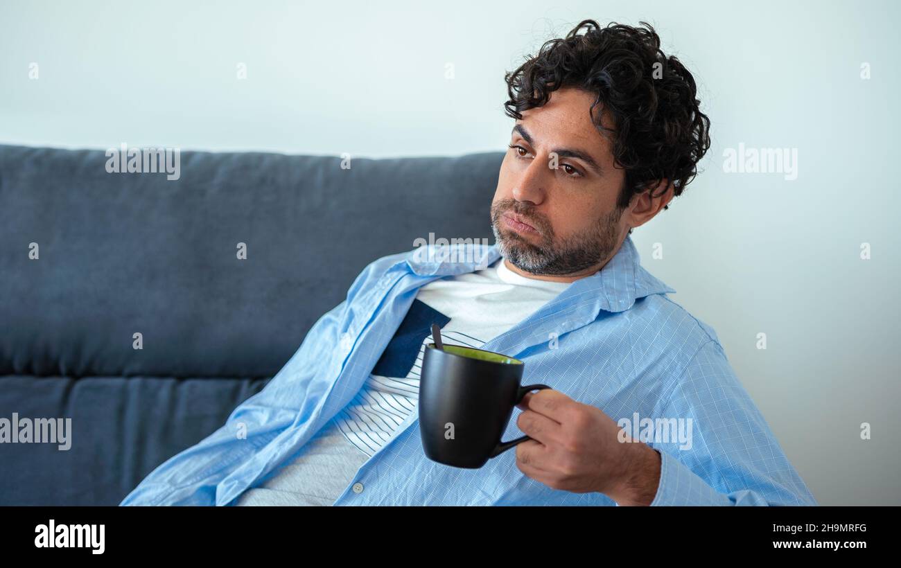 Handsome male model feels tired after work and having a cafe. Mature ...