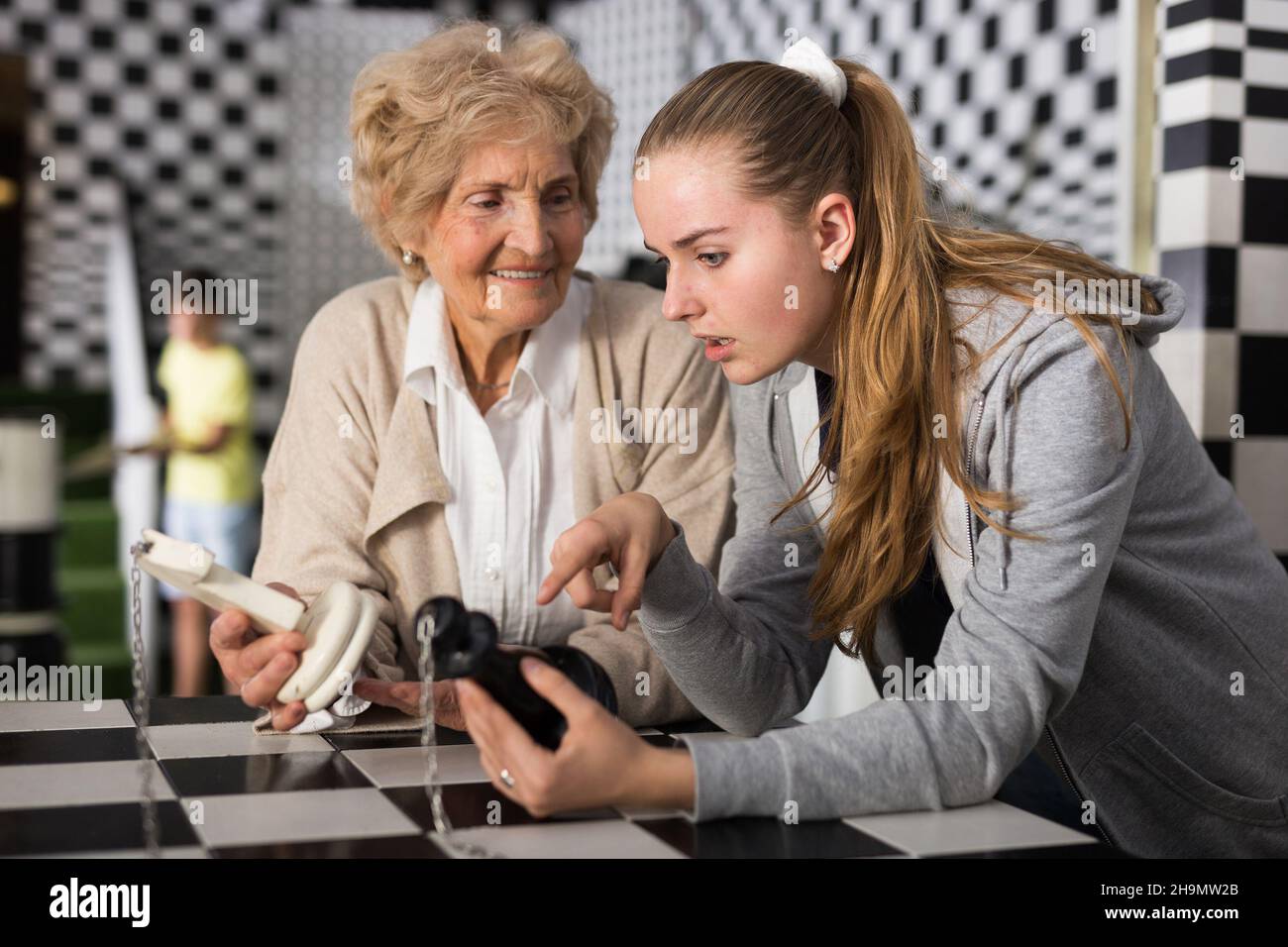 Grandmother with tweenager granddaughter trying to find solution of ...