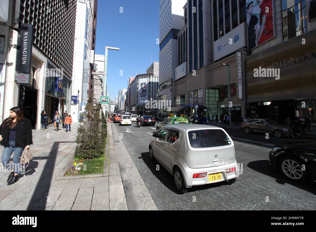 Chuo-dori Ave in the heart of Ginza, Tokyo with tall buildings, luxury ...