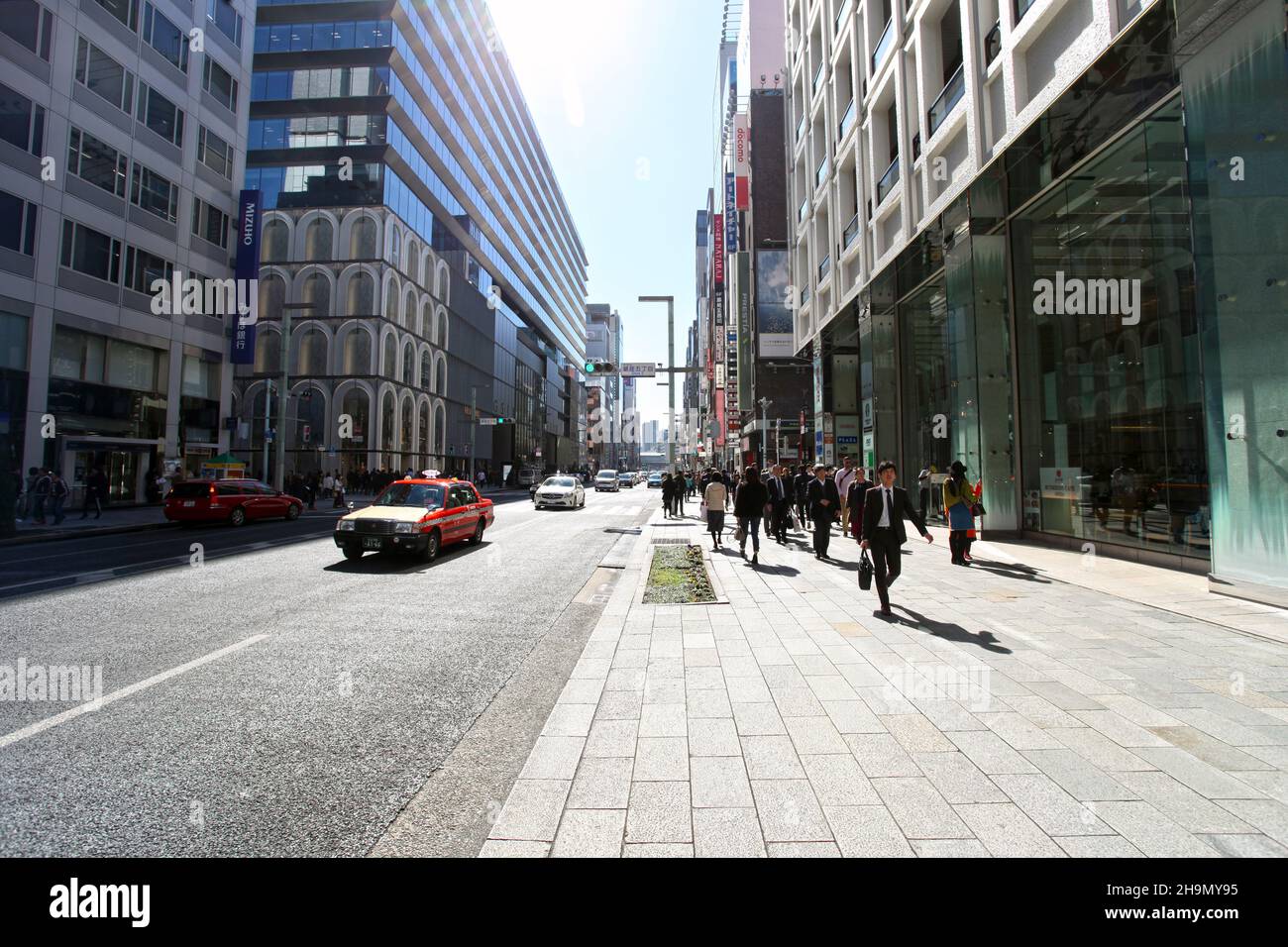 Chuo-dori Ave in the heart of Ginza, Tokyo with tall buildings, luxury ...