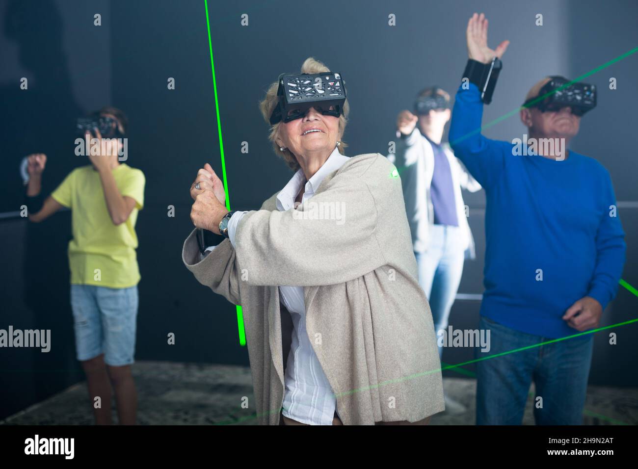 Family playing VR games together Stock Photo - Alamy