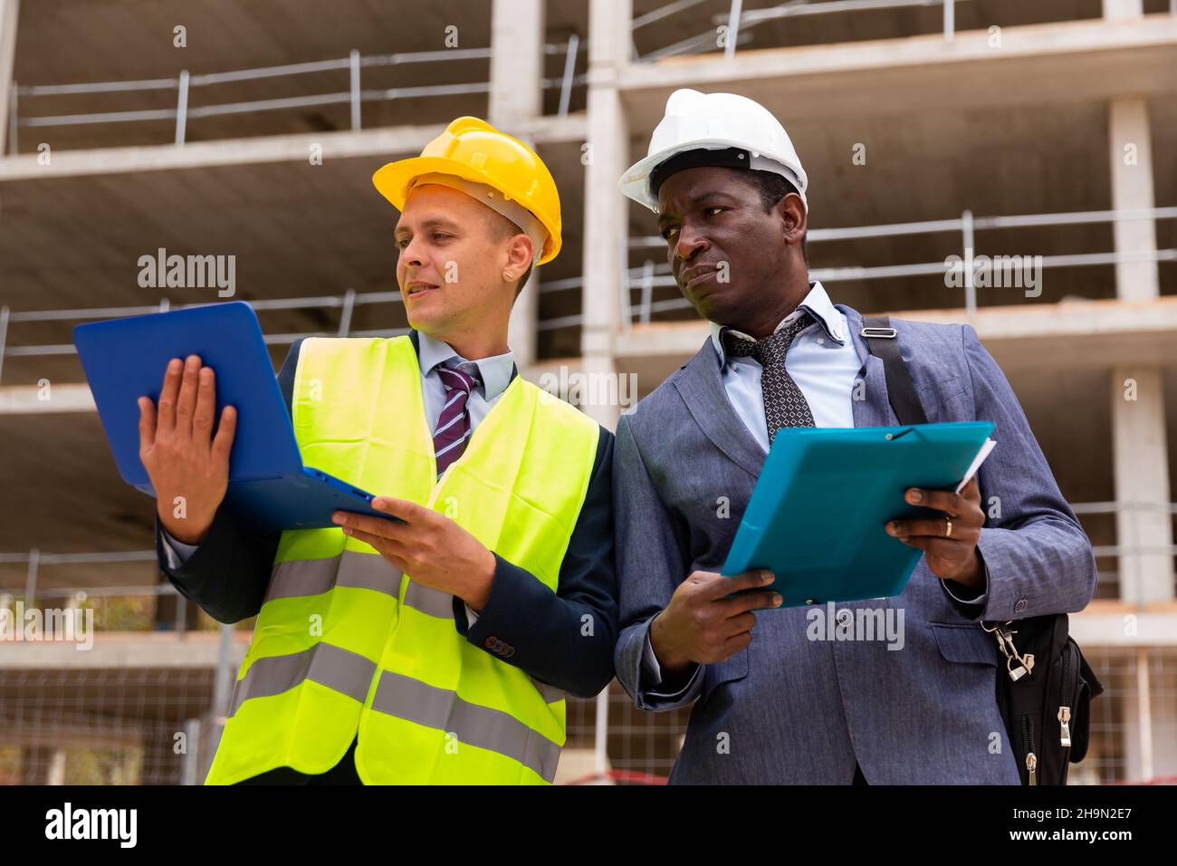 Construction conversation suit hardhat hi-res stock photography and ...