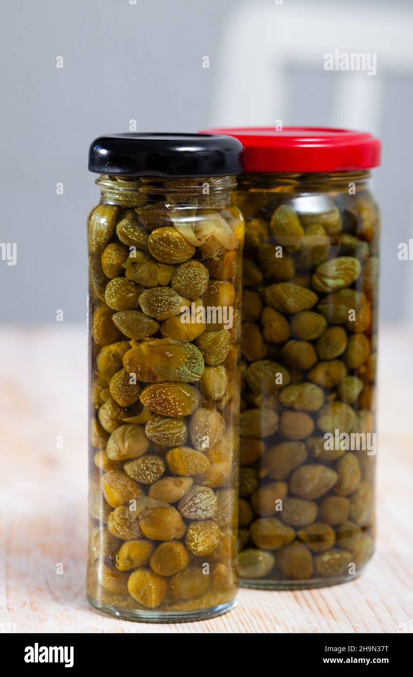 Canned capers in glass jar Stock Photo - Alamy