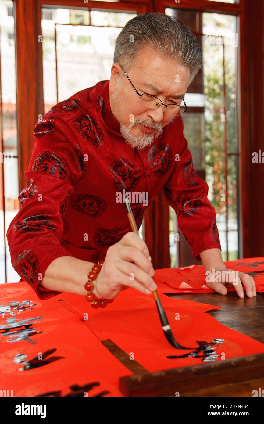 Older men write calligraphy Stock Photo - Alamy Older men write calligraphy Stock Photo - Alamy