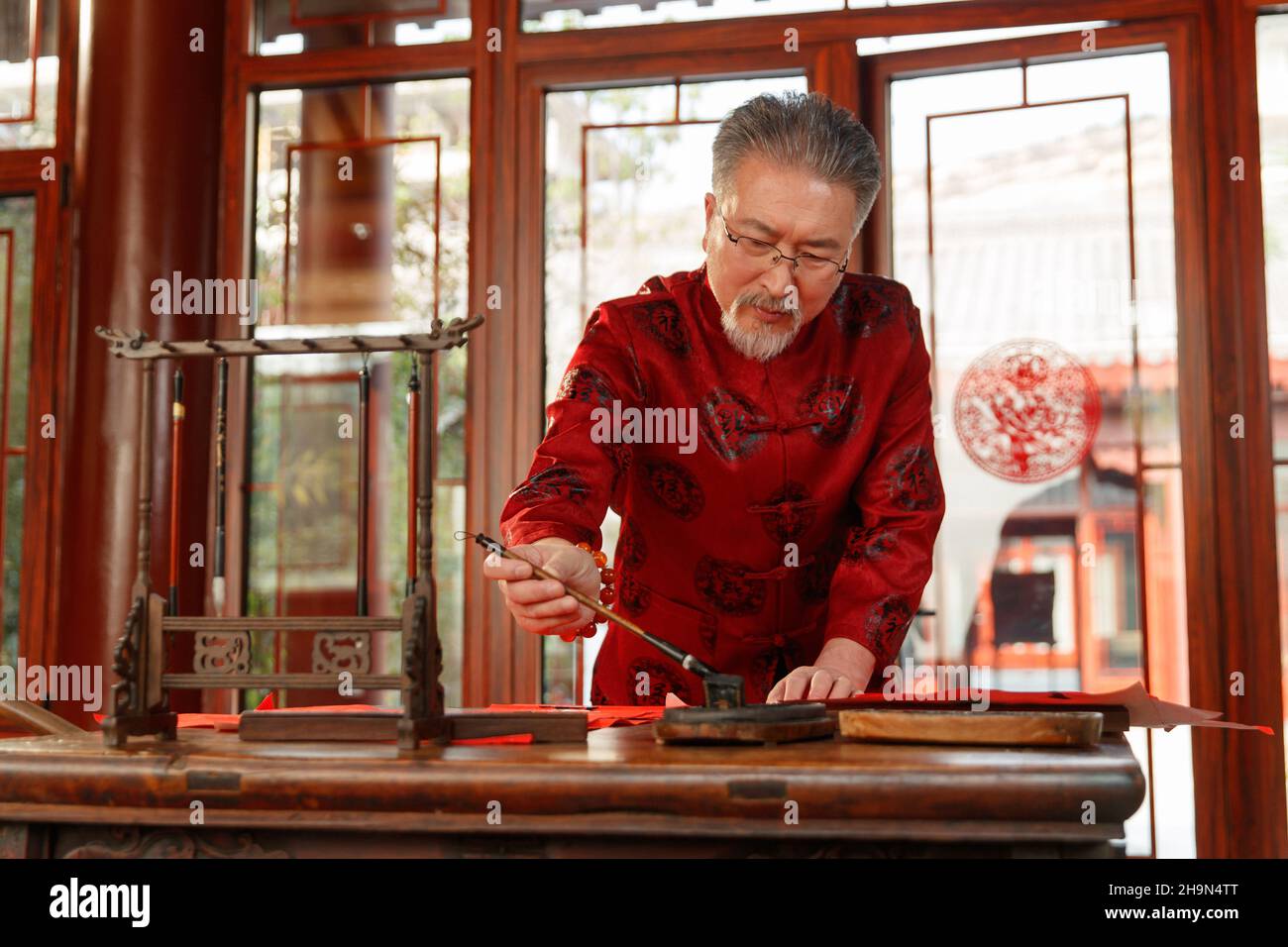 Older men write calligraphy Stock Photo - Alamy Older men write calligraphy Stock Photo - Alamy