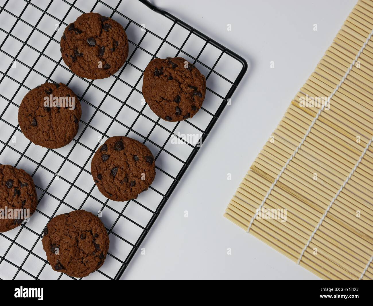 chocolate chip cookies on cooling rack with white background. Good ...
