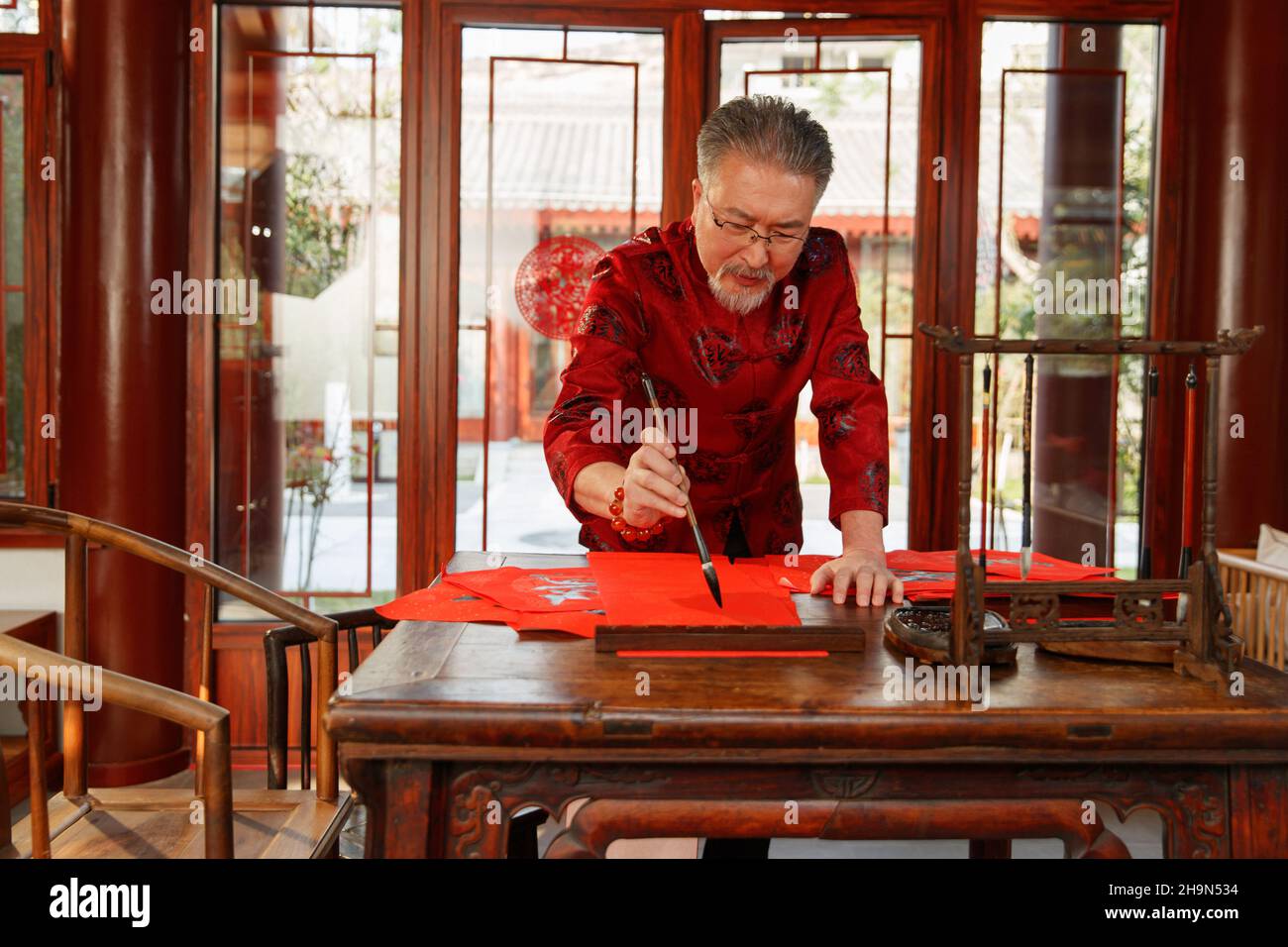 Older men write calligraphy Stock Photo - Alamy Older men write calligraphy Stock Photo - Alamy