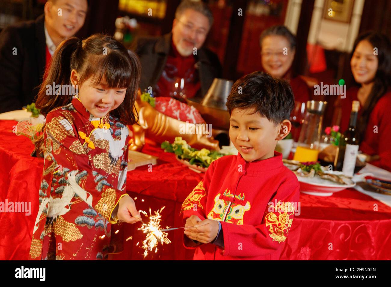 Happy family celebrate the New Year Stock Photo - Alamy