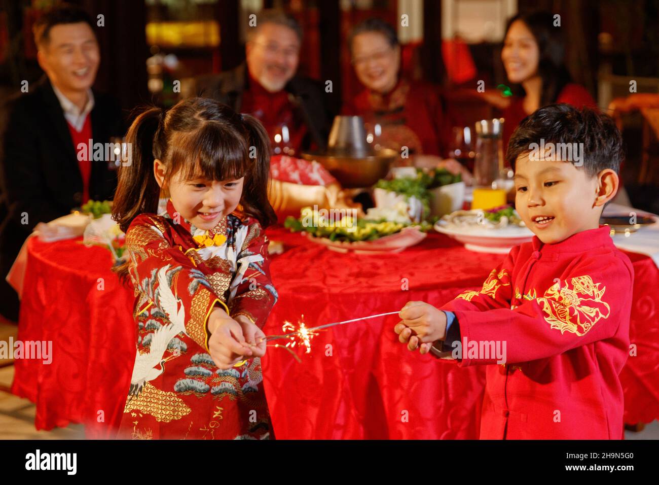 Happy family celebrate the New Year Stock Photo - Alamy