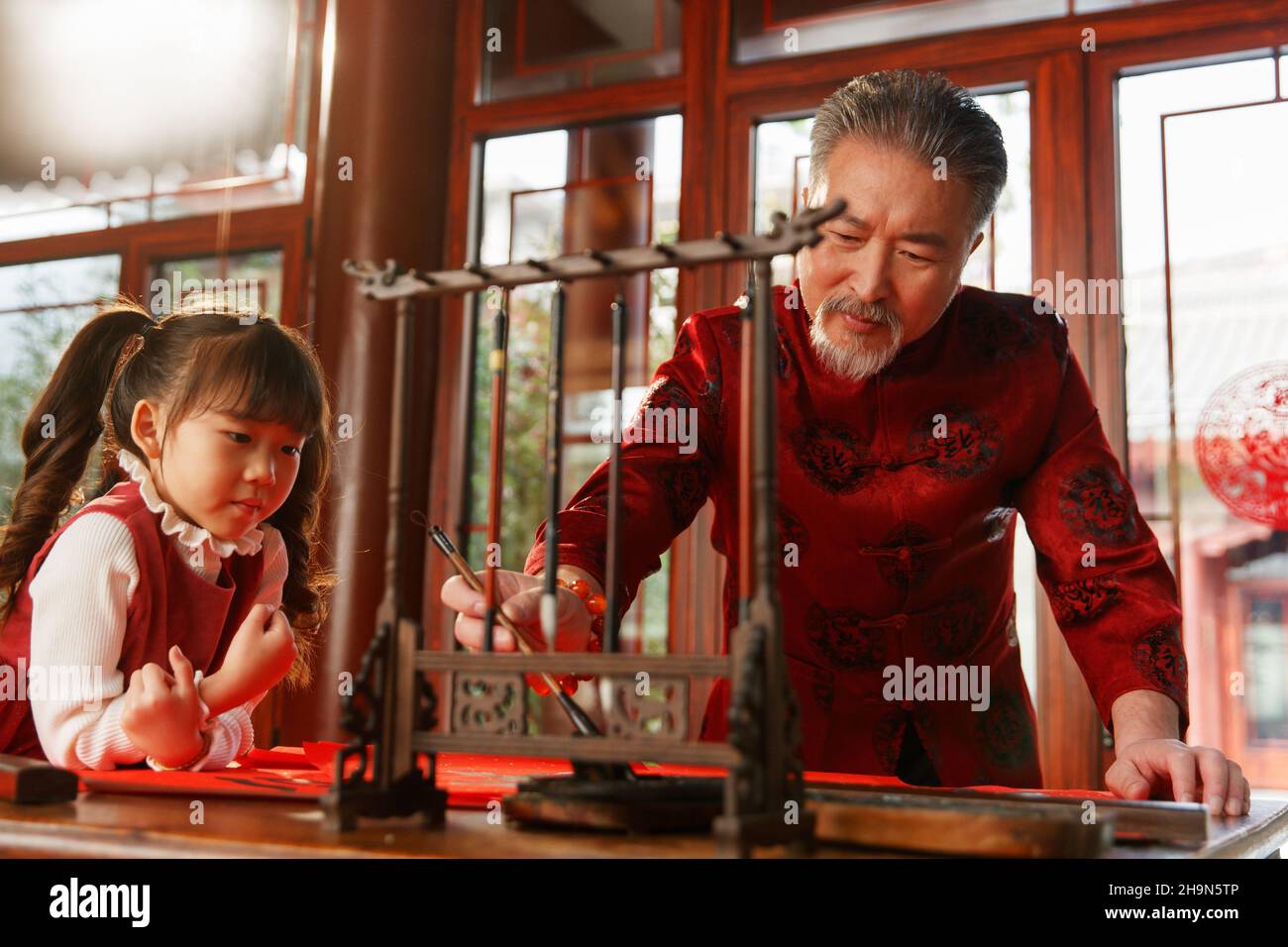 Between the two people together to write Spring Festival couplets Stock ...