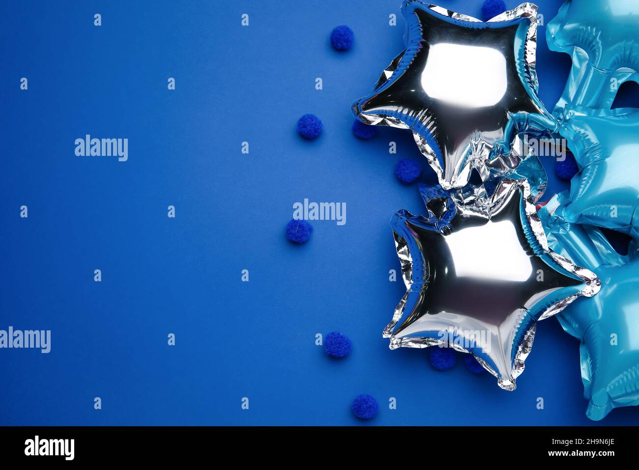 Beautiful different balloons on blue background Stock Photo - Alamy