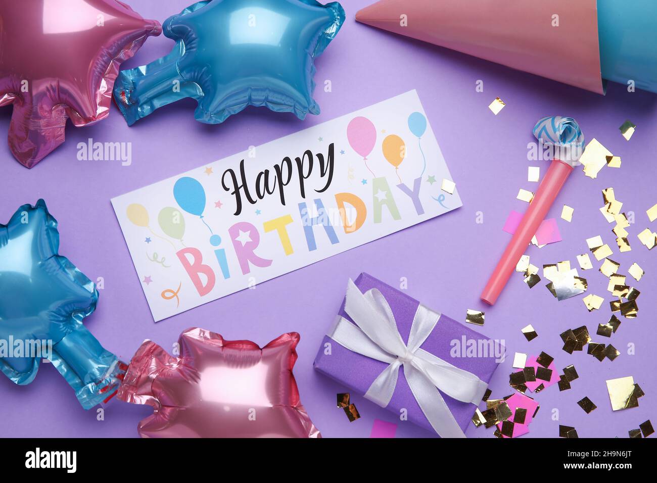 Text HAPPY BIRTHDAY and party set on purple background Stock Photo - Alamy