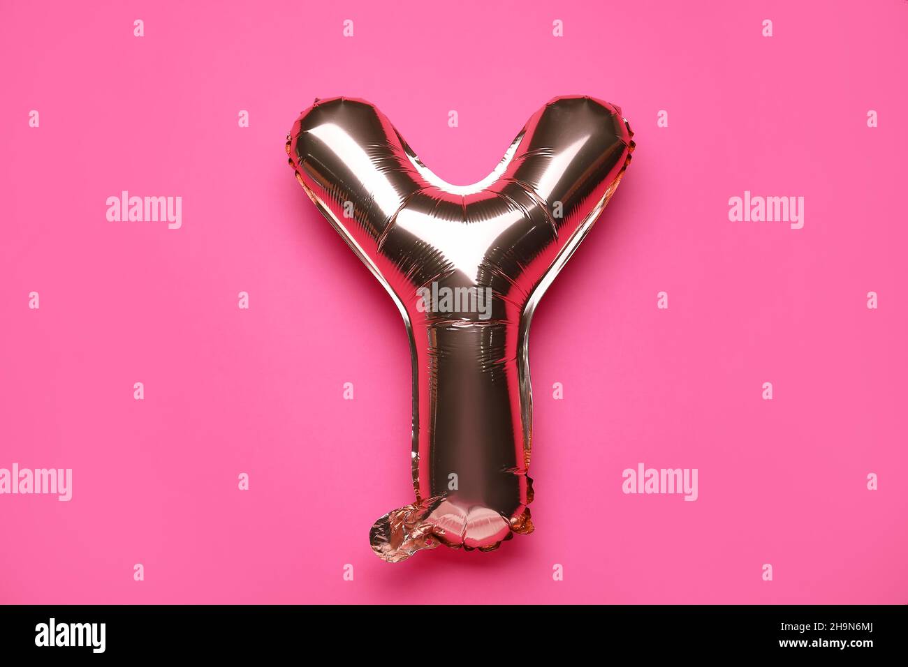 Balloon in shape of letter Y on pink background Stock Photo - Alamy