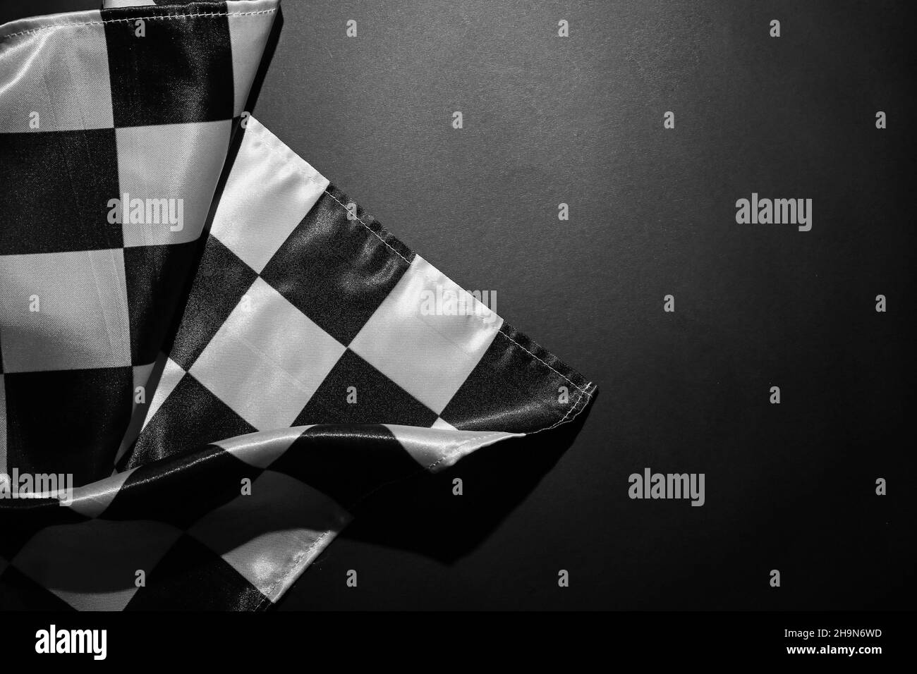 Racing flag on black background Stock Photo - Alamy