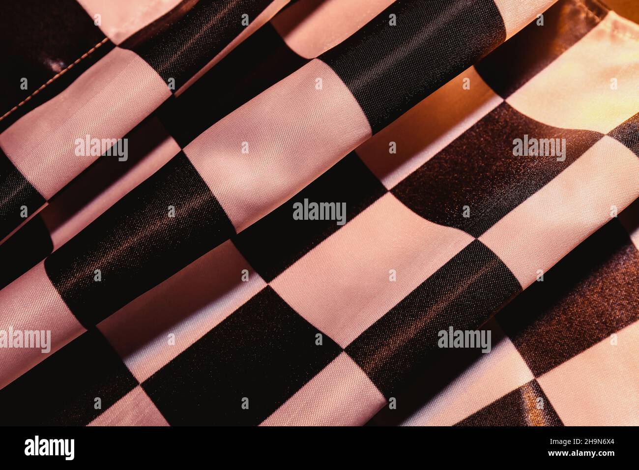 Racing flag as background, closeup view Stock Photo - Alamy