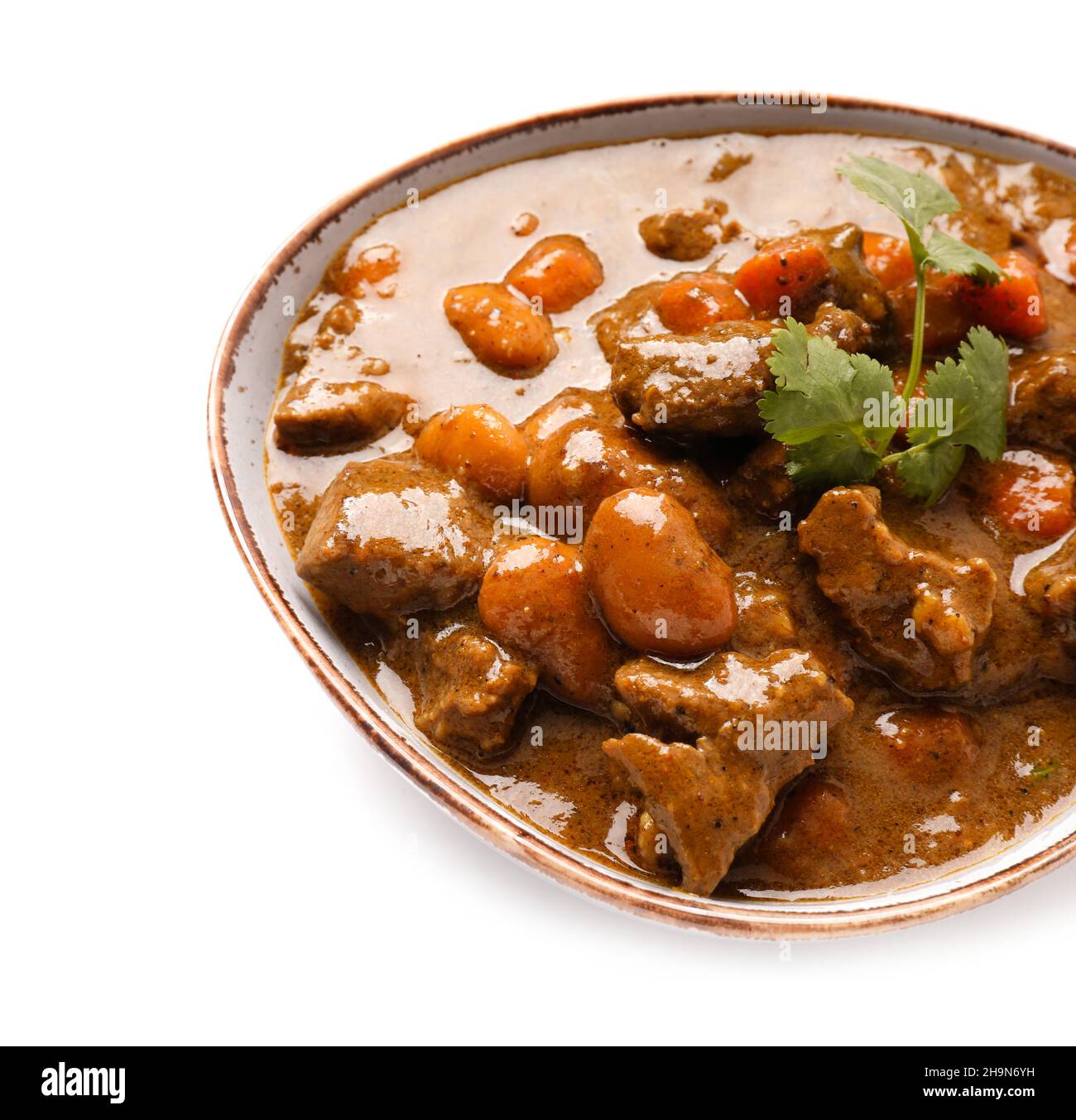 Plate with tasty beef curry on white background Stock Photo - Alamy