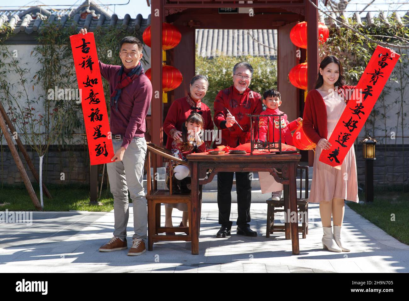 Happy family write Spring Festival couplets to celebrate the New Year ...