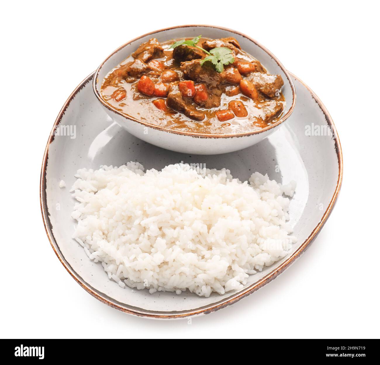 Plate with tasty beef curry and rice on white background Stock Photo ...