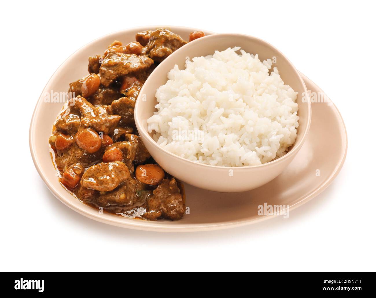 Plate with tasty beef curry and rice on white background Stock Photo ...