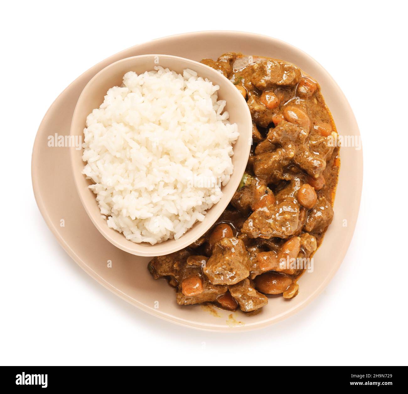 Plate with tasty beef curry and rice on white background Stock Photo ...