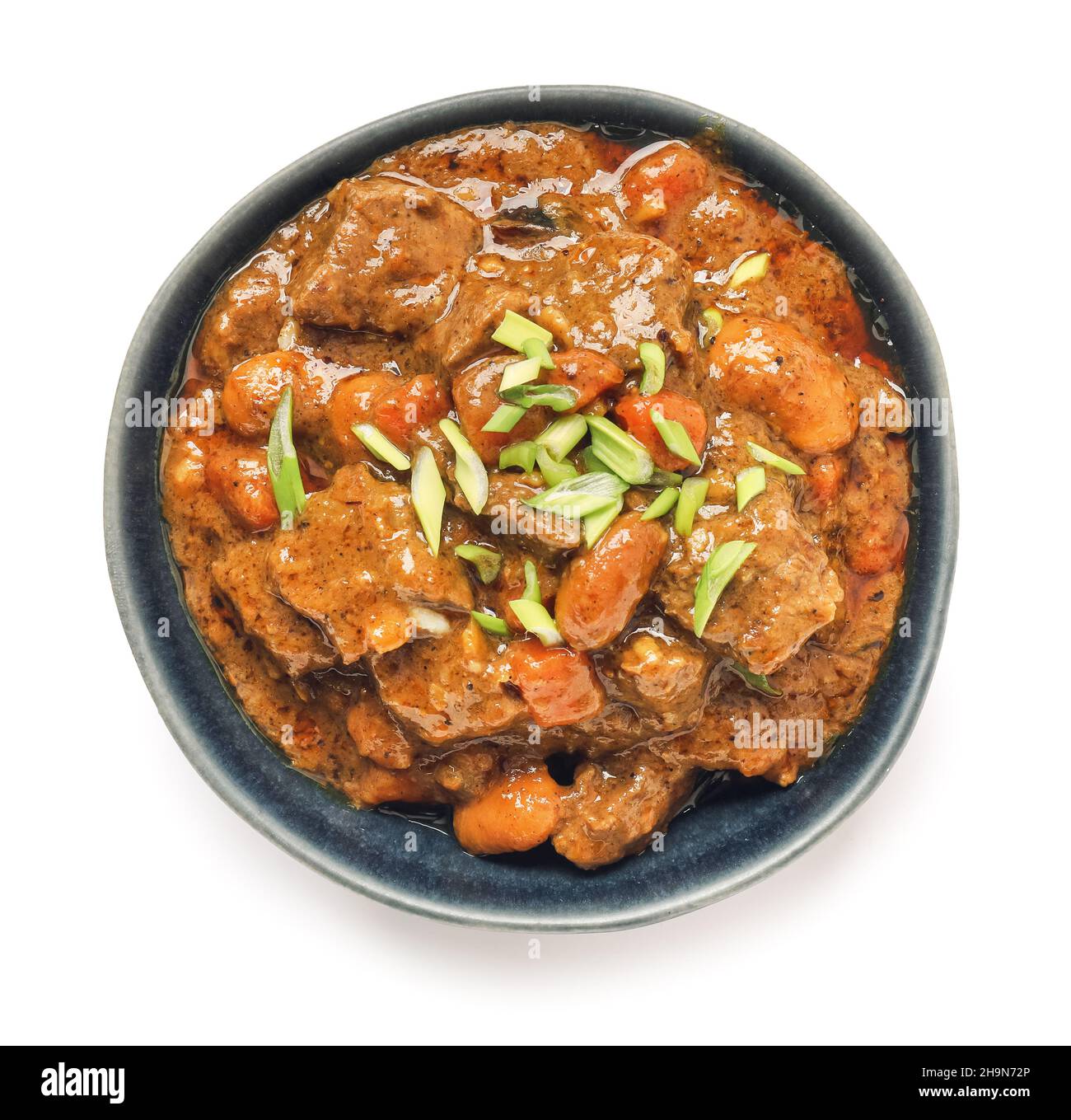 Plate with tasty beef curry on white background Stock Photo - Alamy