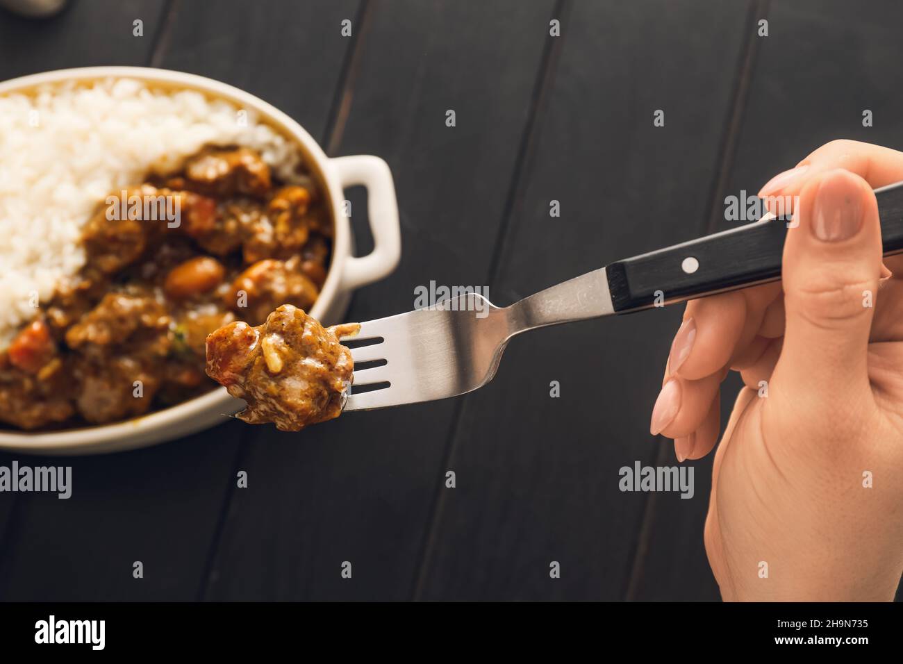 Female eating curry rice hi-res stock photography and images - Alamy