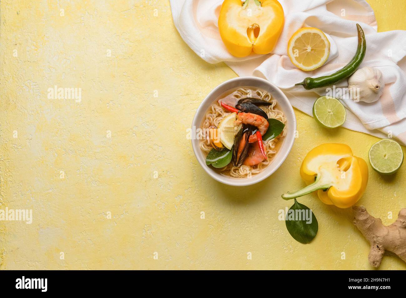 Bowl of spicy Thai soup on color background Stock Photo - Alamy