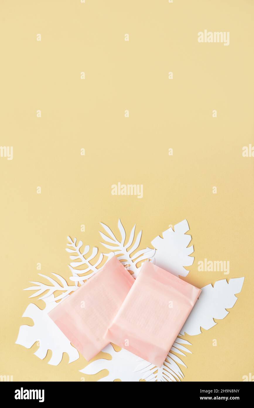 Menstrual pads on yellow background Stock Photo - Alamy